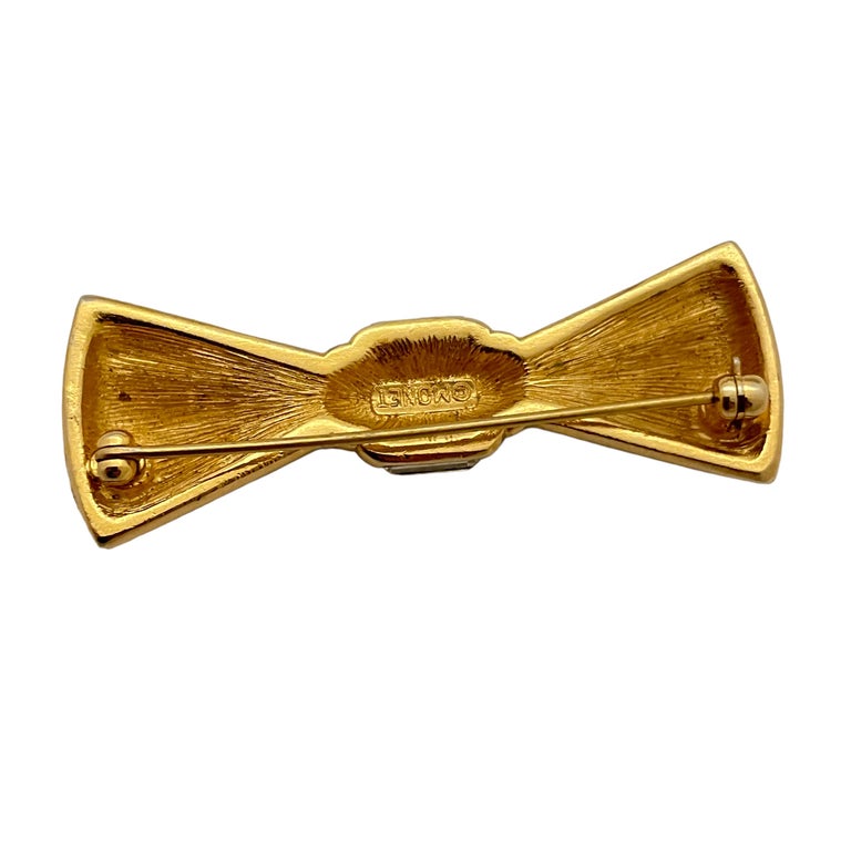 Vintage MONET bow gold rhinestone designer brooch For Sale at 1stDibs