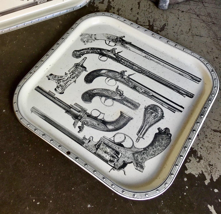 Vintage pair of Piero Fornasetti pair of toleware trays ‘Pistole’ circa 1970’s For Sale at 1stDibs