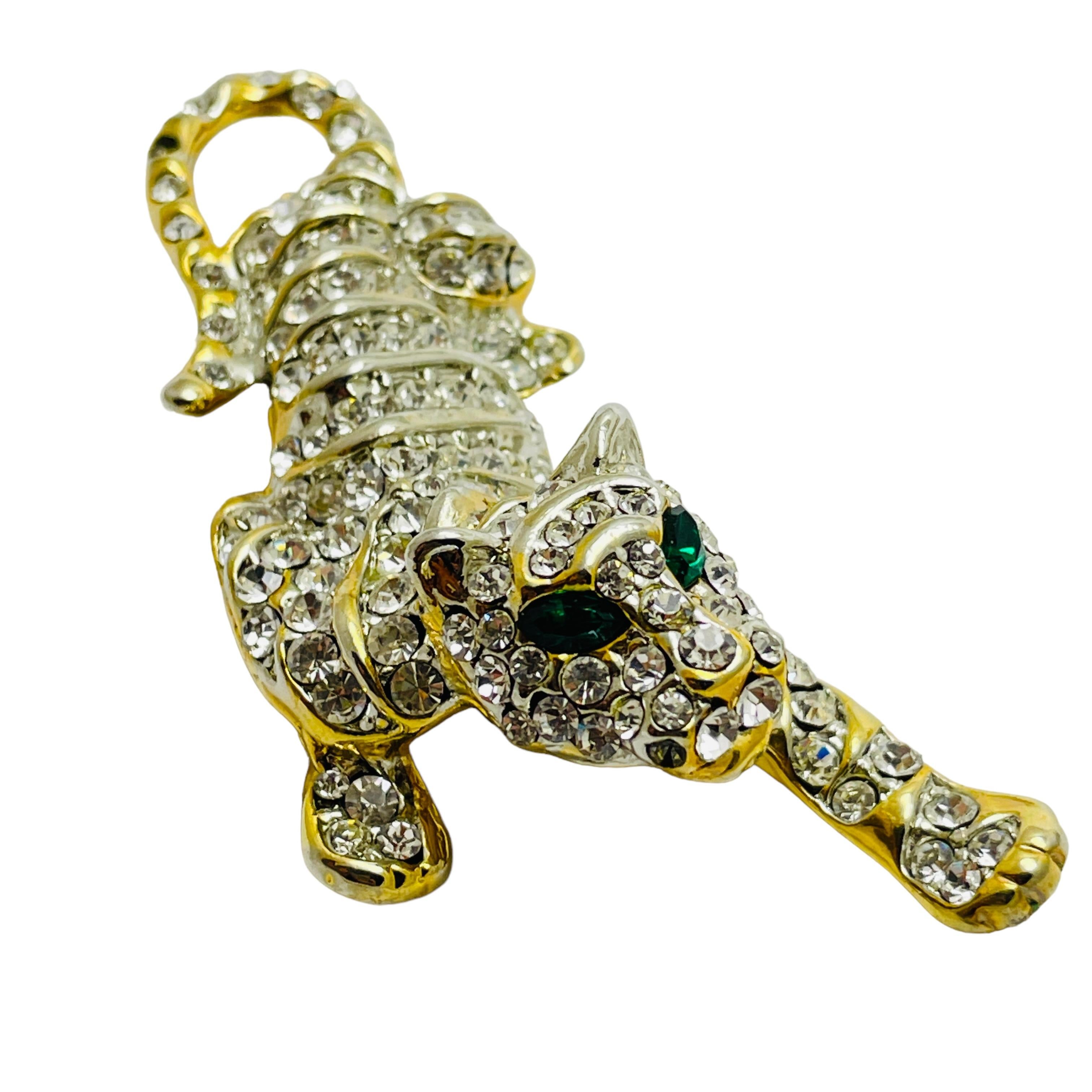 Vintage panther gold tone rhinestones designer brooch For Sale at 1stDibs