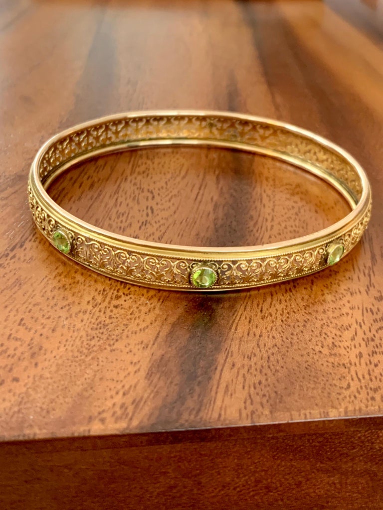 Vintage Peridot 14 Karat Yellow Gold Bangle Bracelet at 1stDibs