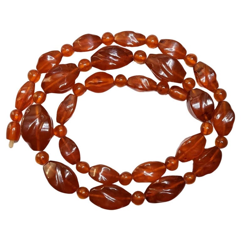 Vintage Pressed Carved Baltic Amber Necklace at 1stDibs