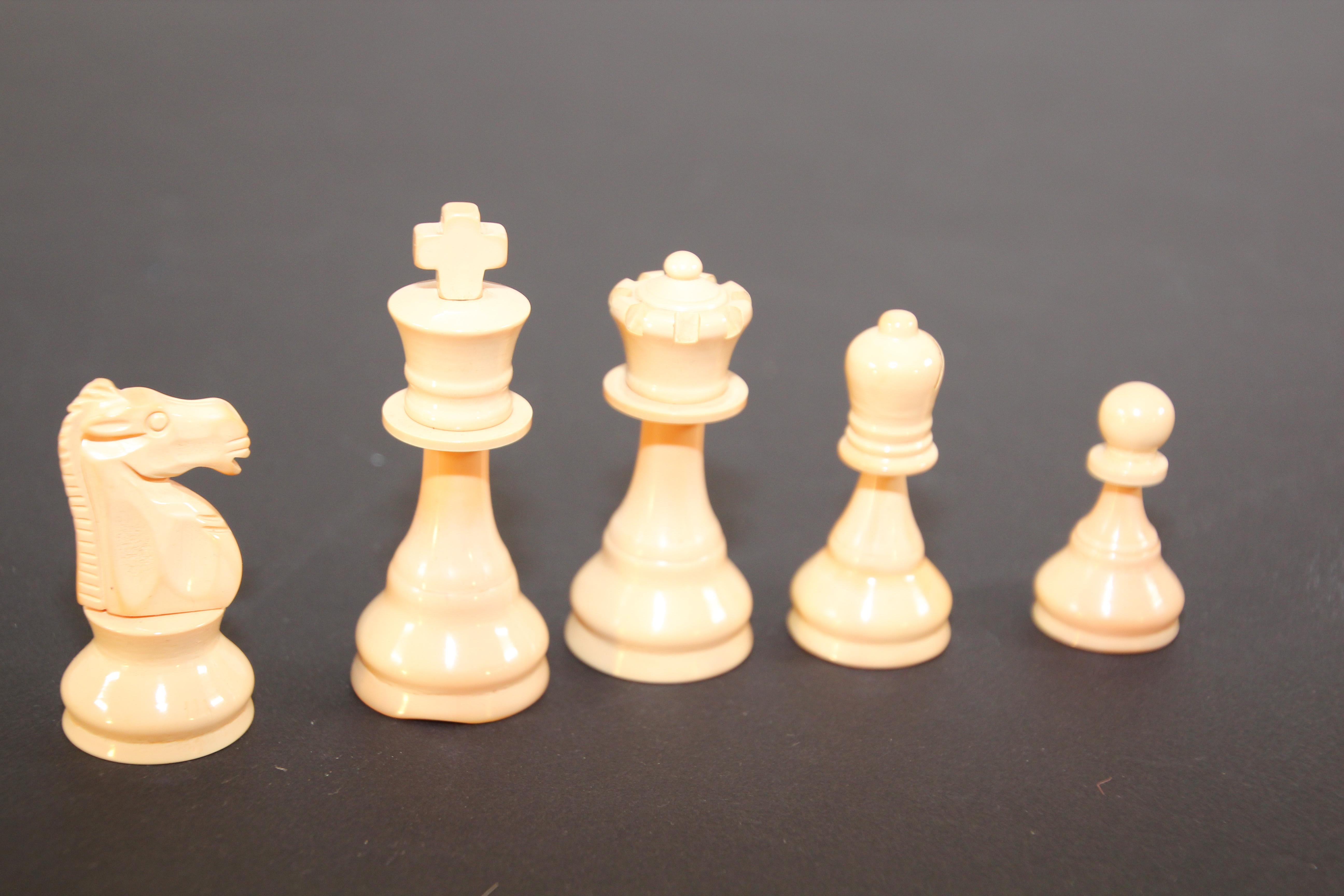 Vintage Red and Cream Bakelite Chess Pieces Set at 1stDibs