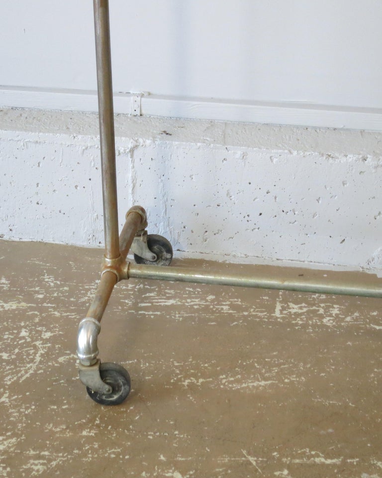 Vintage Rolling Garment Rack Clothes Rack For Sale at 1stDibs