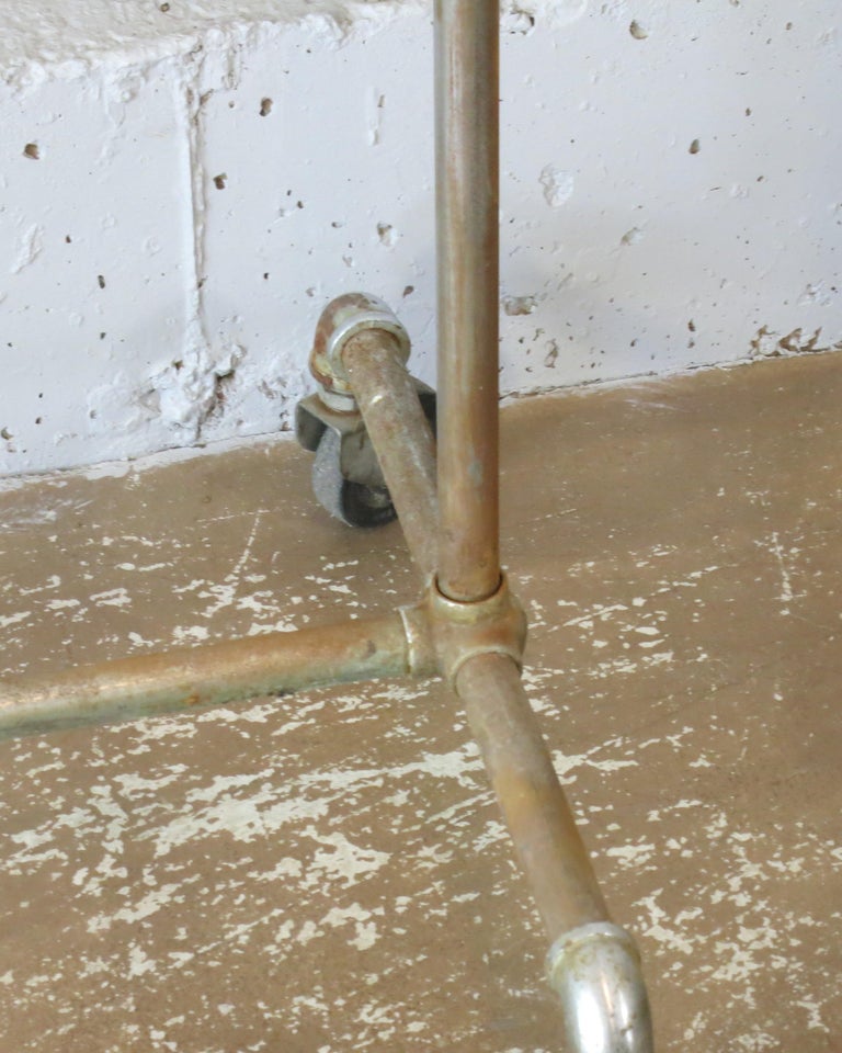 Vintage Rolling Garment Rack Clothes Rack For Sale at 1stDibs