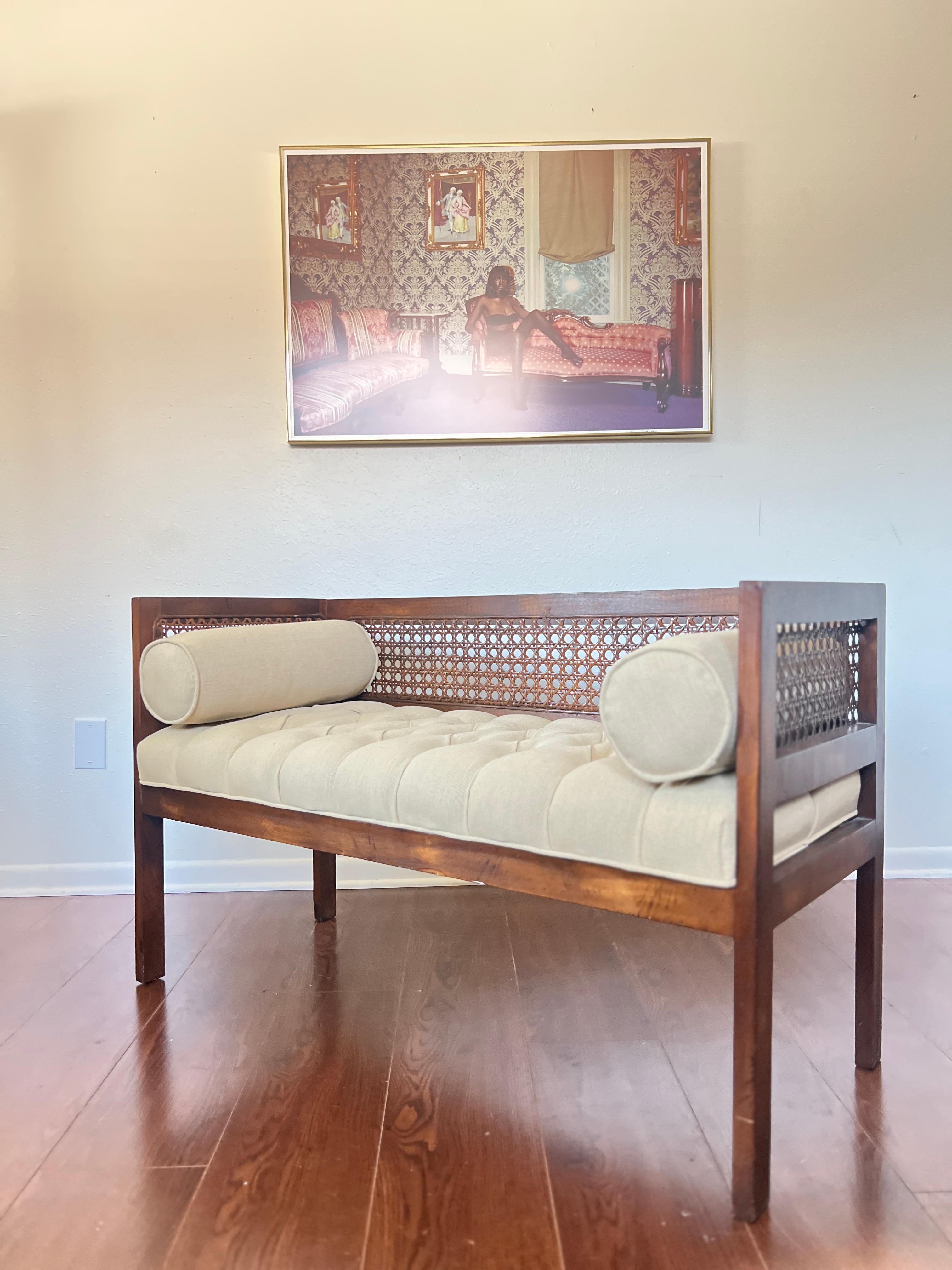 Vintage settee with a cane back and tufted seat in a cream color For ...