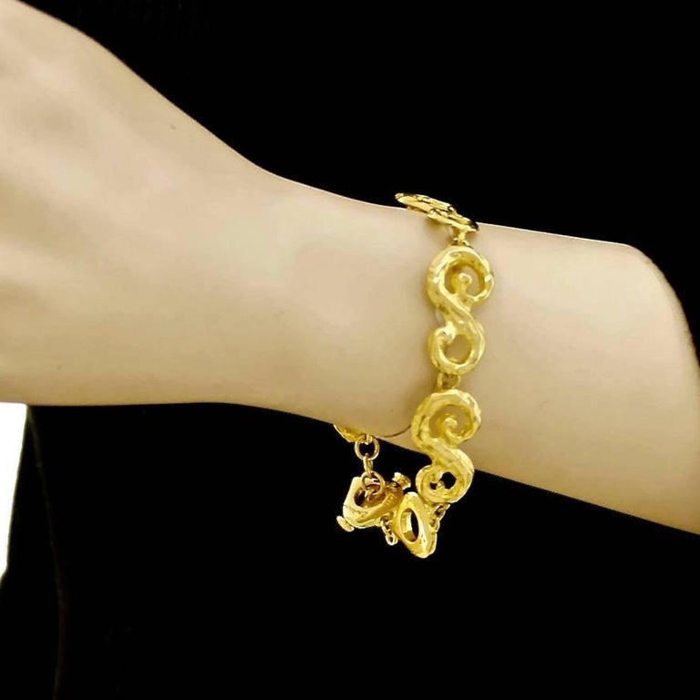 Vintage YVES SAINT LAURENT Arabesque Hammered Bracelet For Sale at 1stDibs