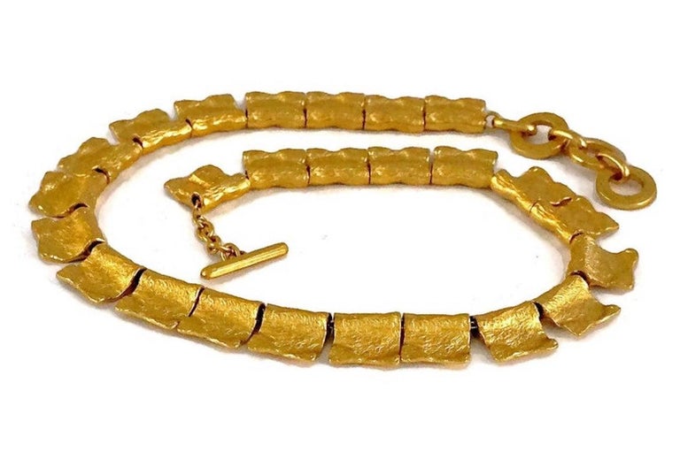 Vintage YVES SAINT LAURENT Ysl Hammered Gilt Flap Charm Necklace at 1stDibs