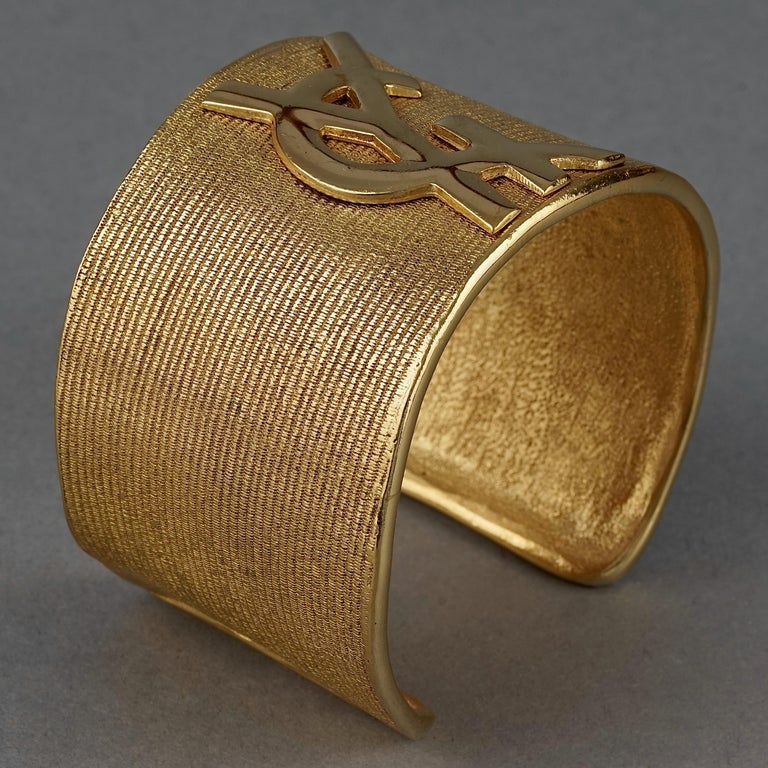 Vintage YVES SAINT LAURENT Ysl Logo Asymmetric Cuff Bracelet at 1stDibs