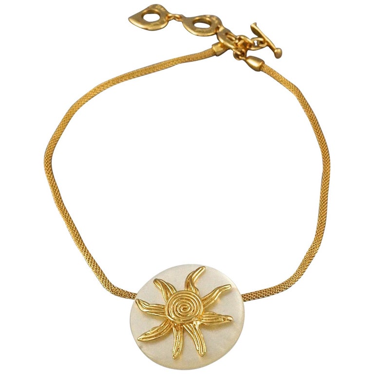 Vintage YVES SAINT LAURENT Ysl Sun Spiral Pearly White Medallion Disc ...