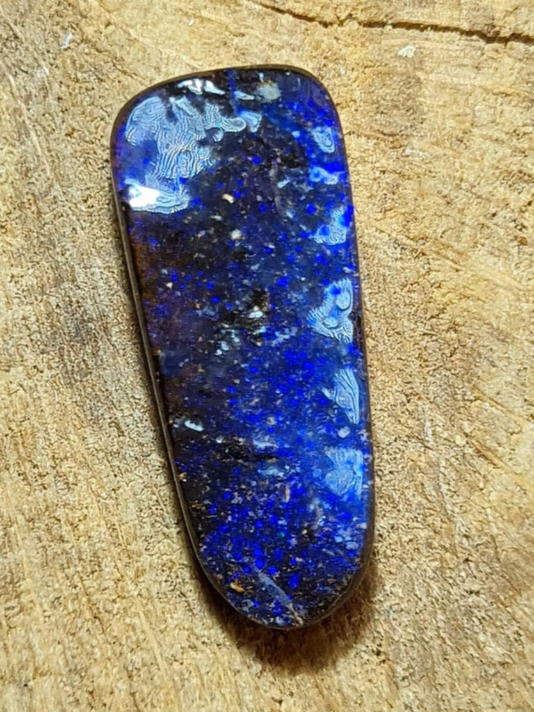 Violetish blue with play of colors, black opal in matrix - 6.42 For ...