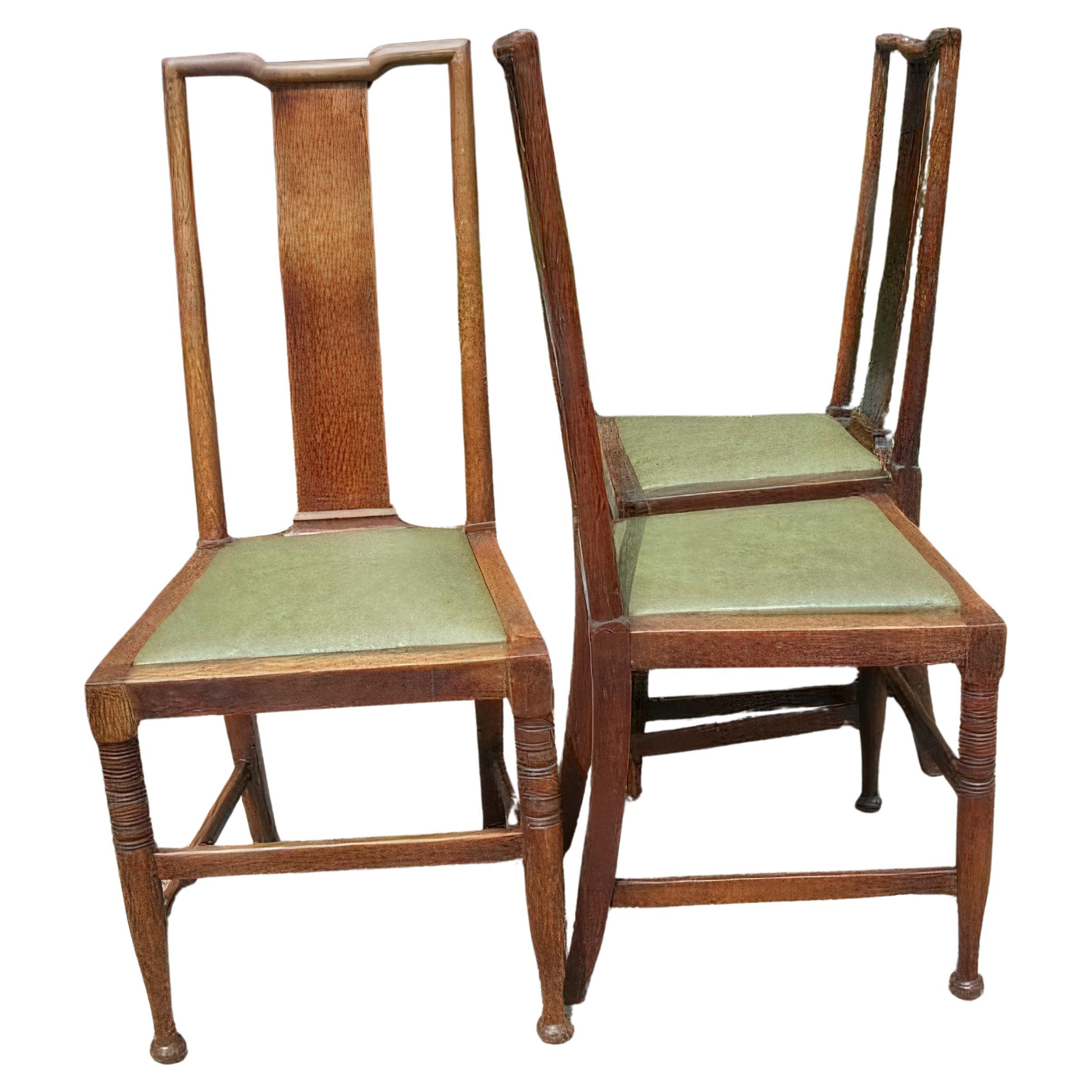 W R Lethaby for Morris and Co. A set of ten oak dining chairs with drop ...