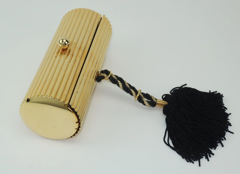 Walborg Gold Metal Cylinder Handbag With Black Tassel Closure at 1stDibs