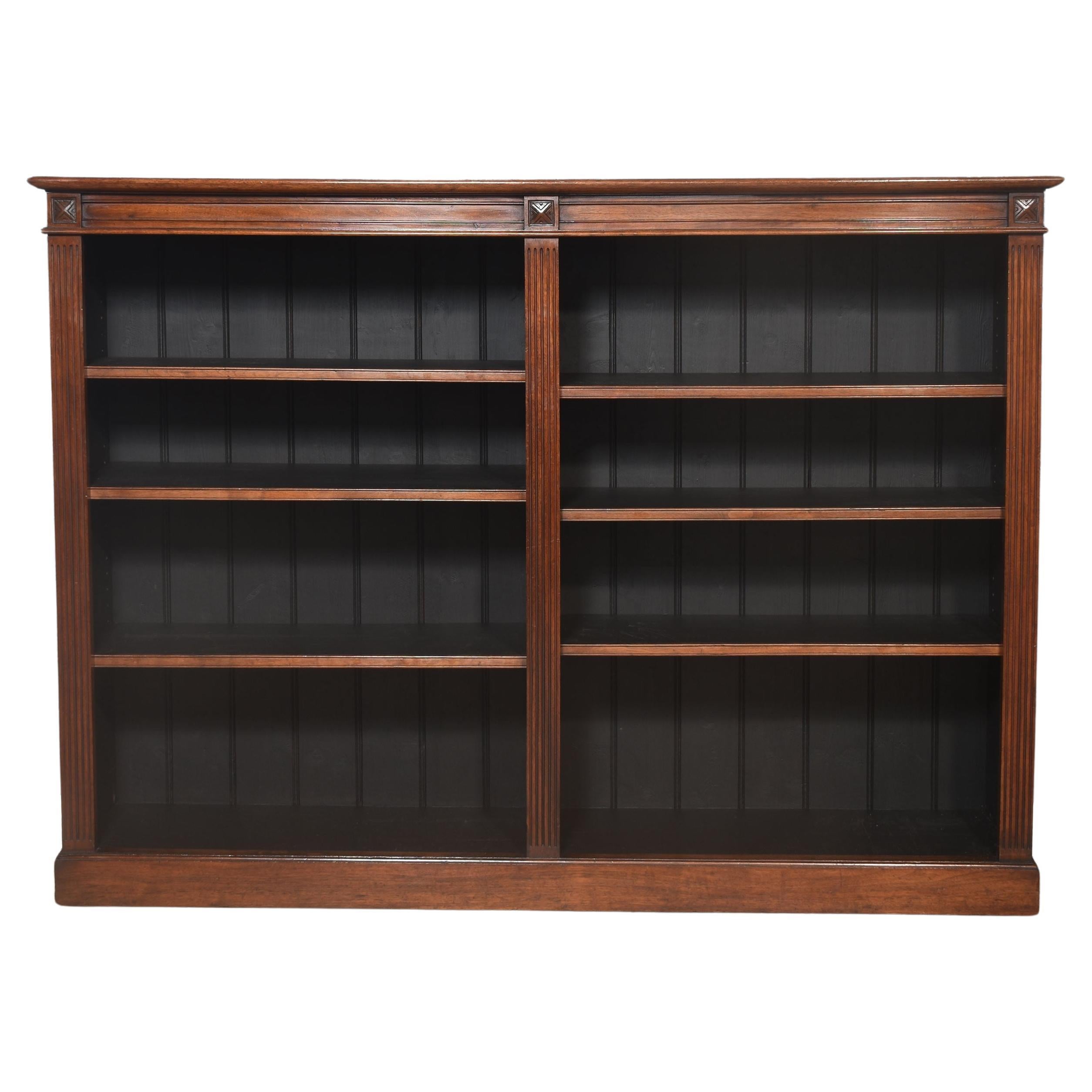Carved walnut open bookcase For Sale at 1stDibs