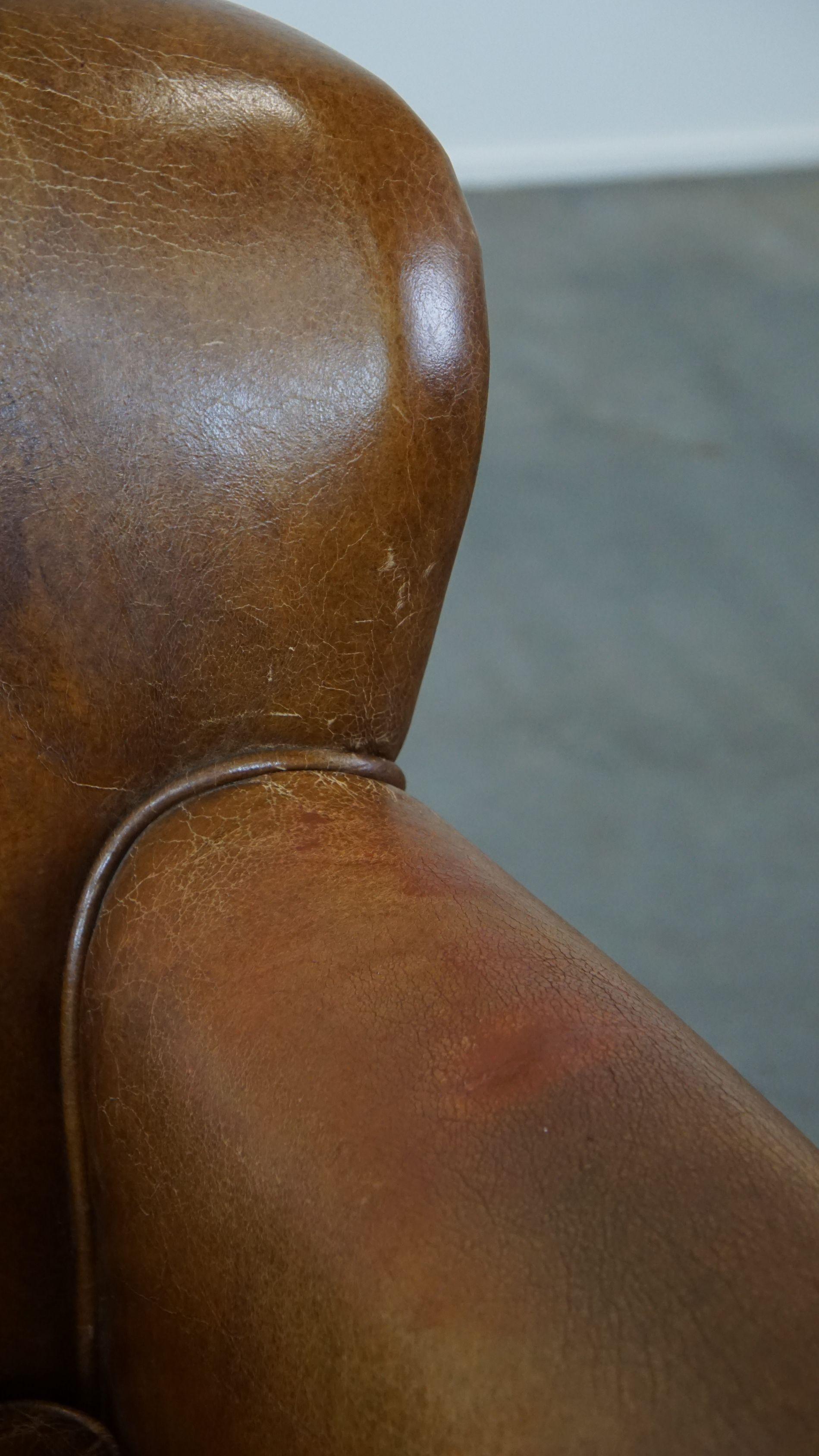 Warm cognac-colored subtle armchair For Sale at 1stDibs