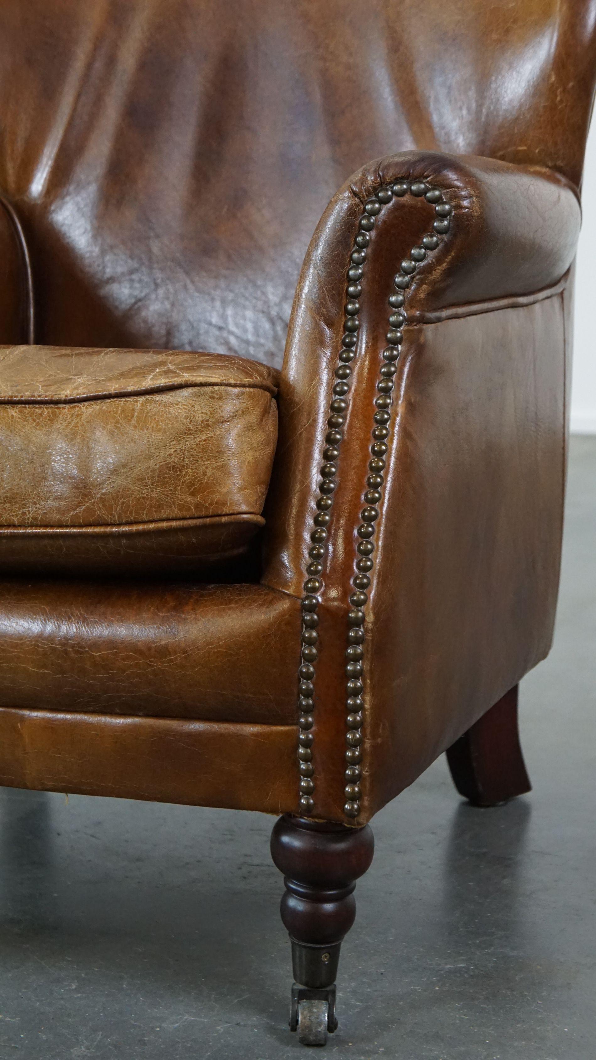 Warm cognac-colored subtle armchair For Sale at 1stDibs