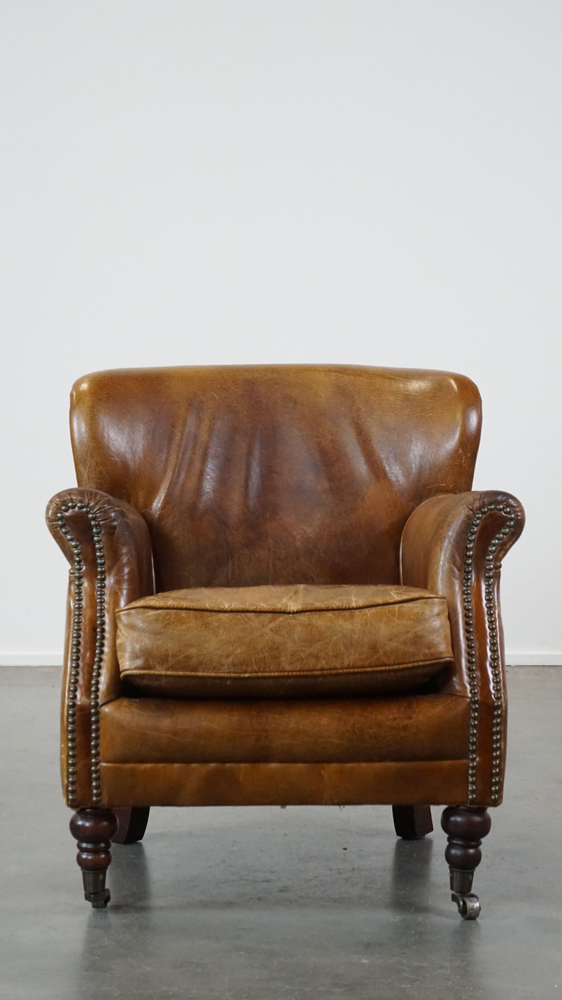 Warm cognac-colored subtle armchair For Sale at 1stDibs