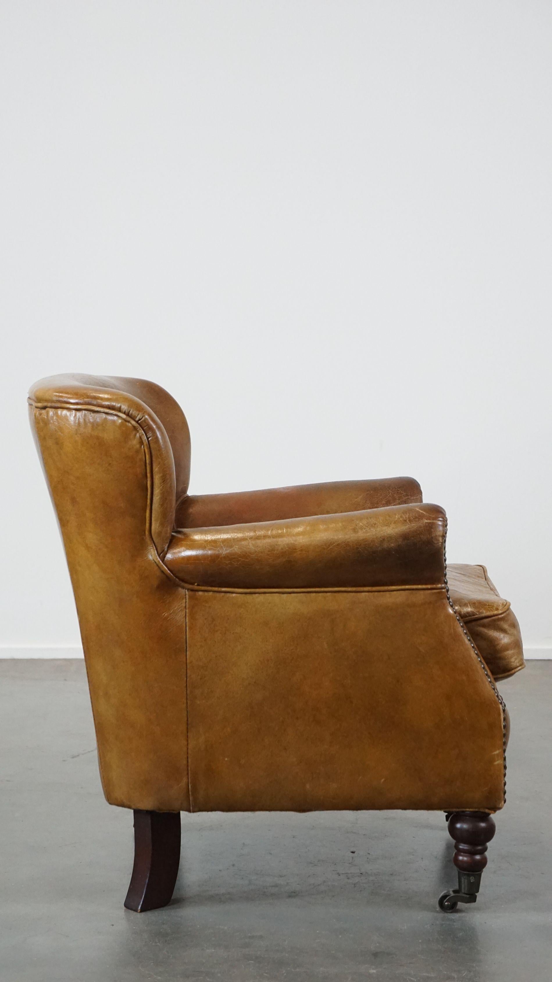 Warm cognac-colored subtle armchair For Sale at 1stDibs