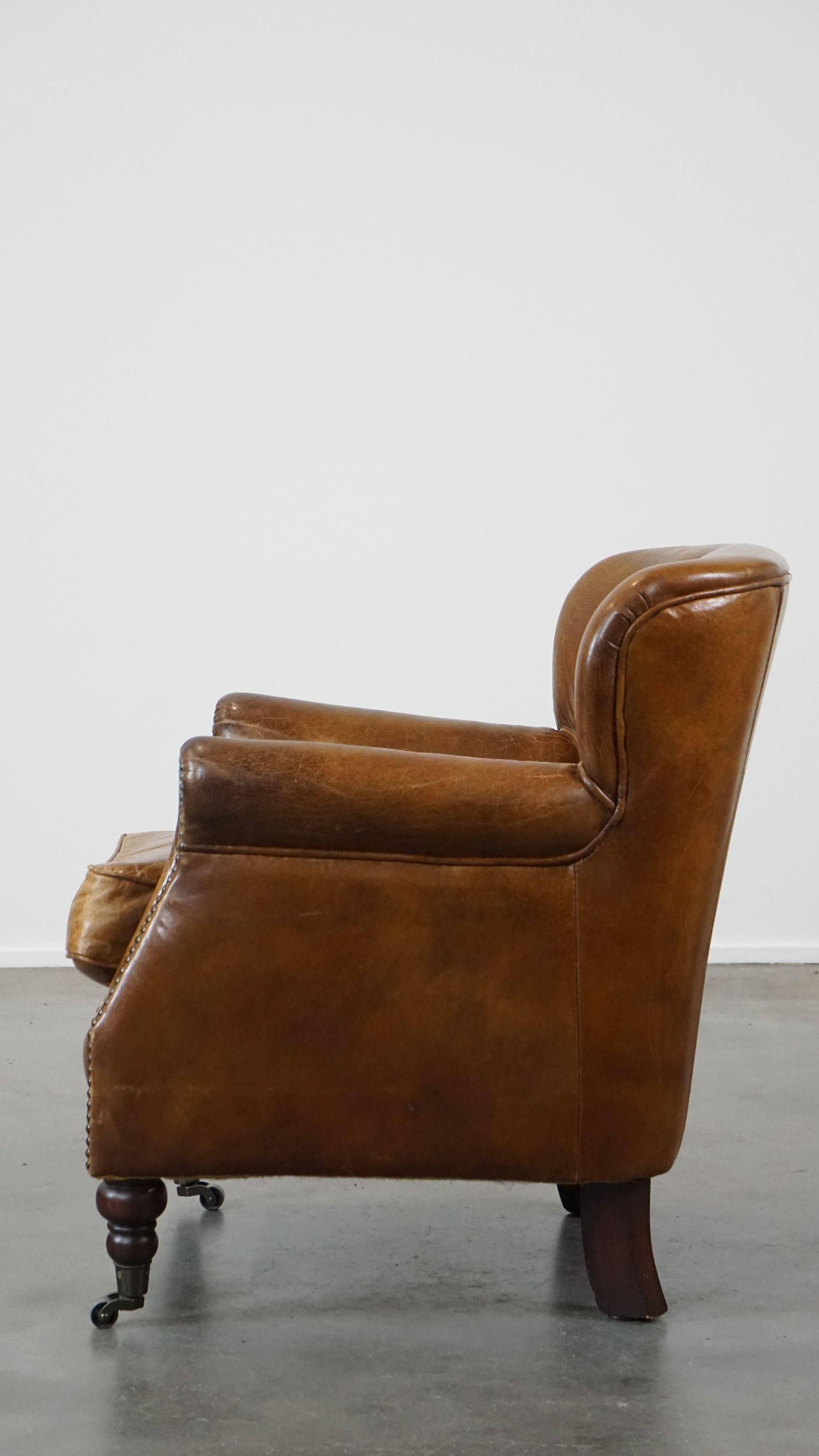 Warm cognac-colored subtle armchair For Sale at 1stDibs