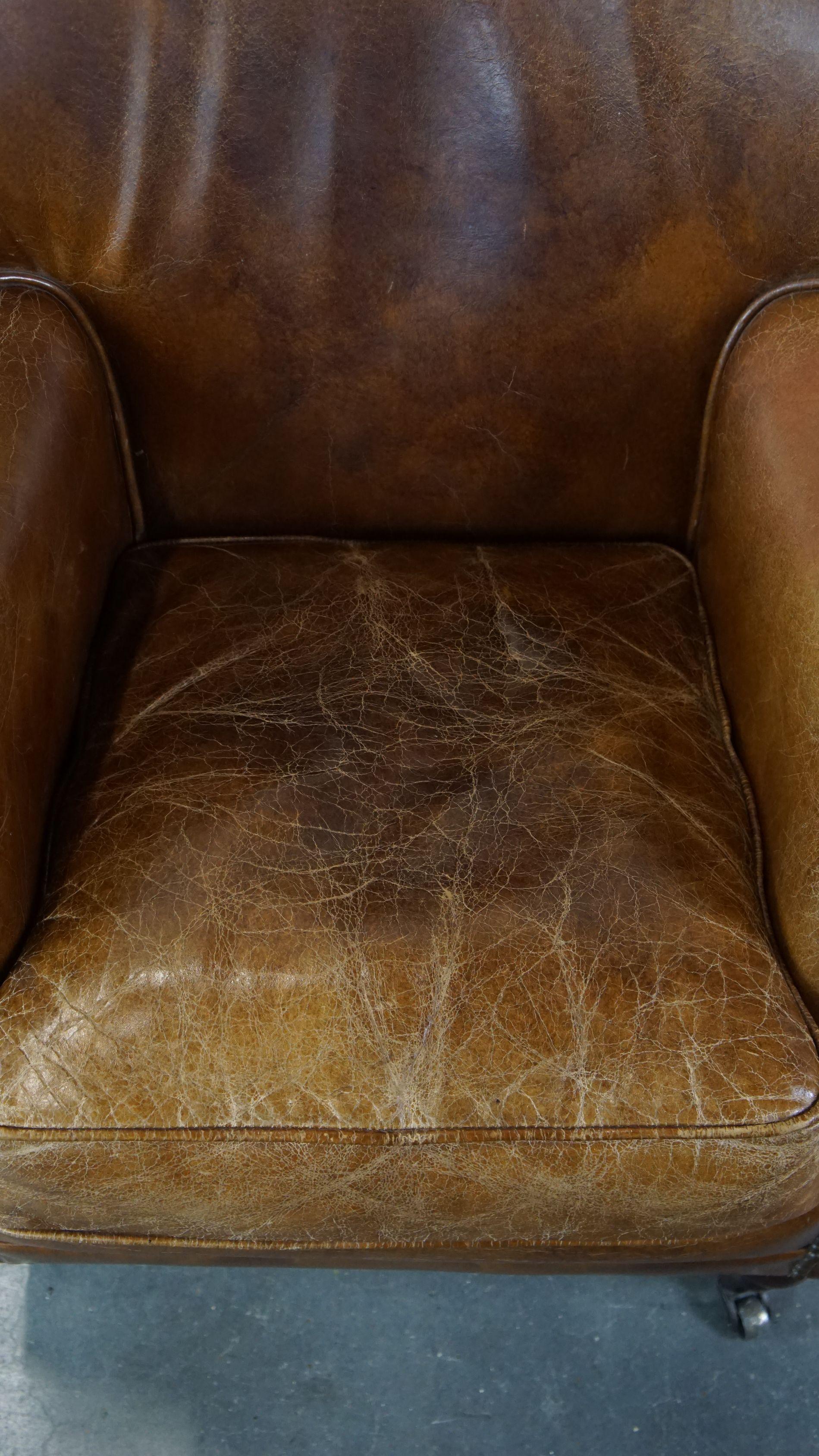 Warm cognac-colored subtle armchair For Sale at 1stDibs