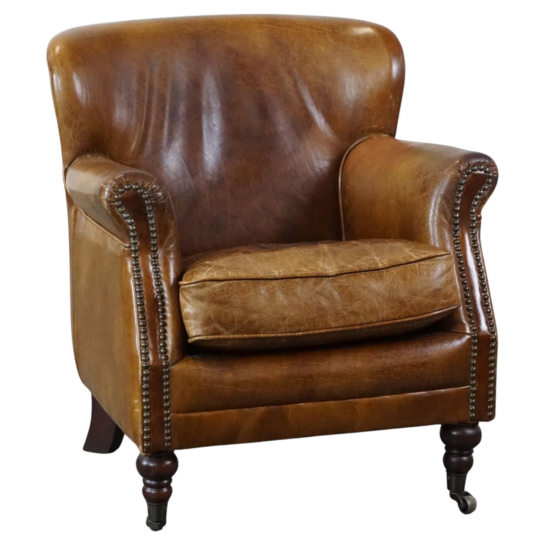 Warm cognac-colored subtle armchair For Sale at 1stDibs