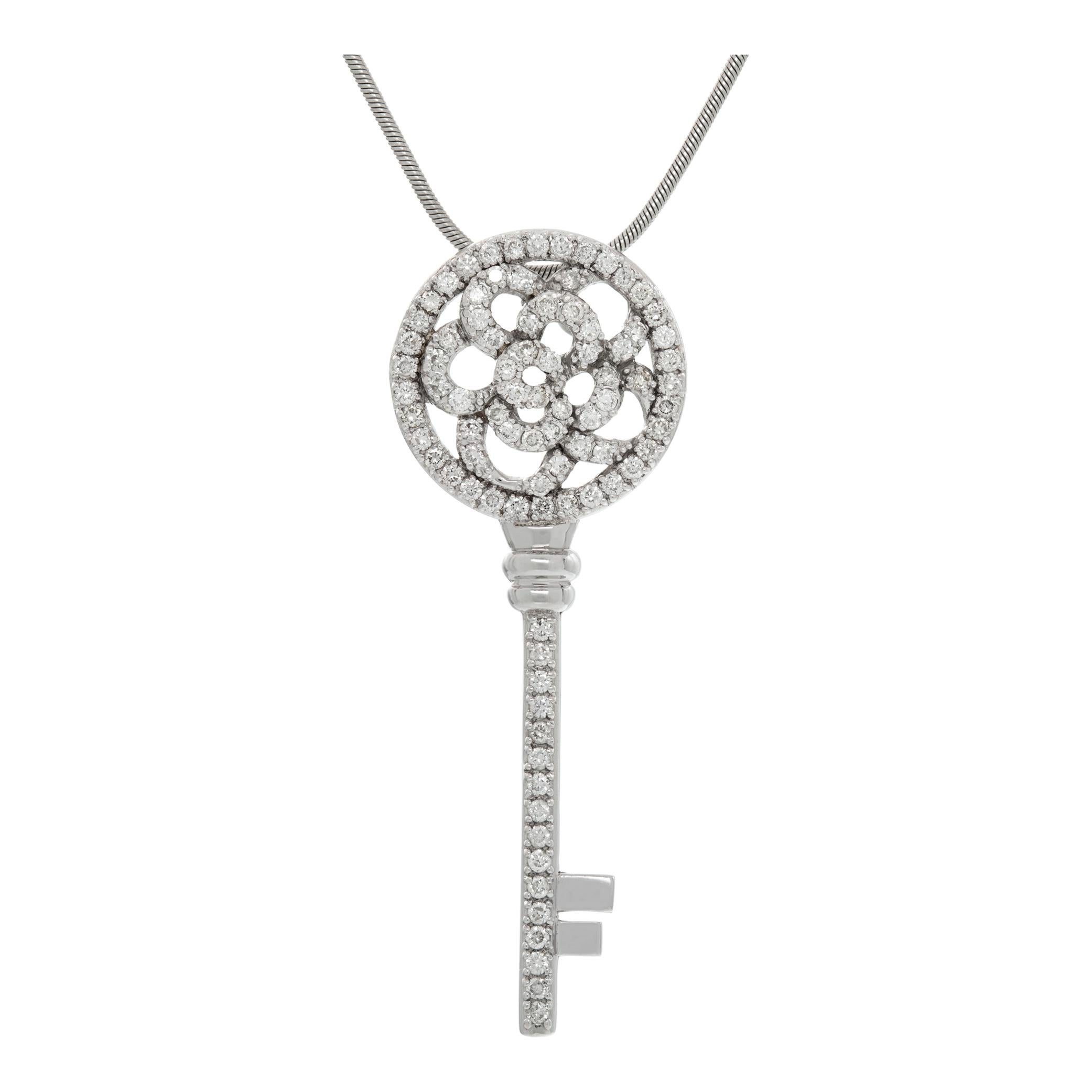 White gold flower-skeleton key pendant w/ pave set diamonds with ...