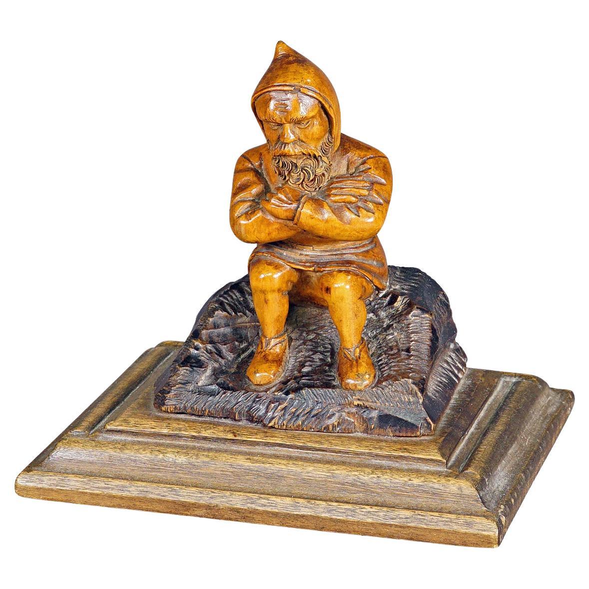 Wooden Carved Black Forest Dwarf Sitting on a Rock For Sale at 1stDibs