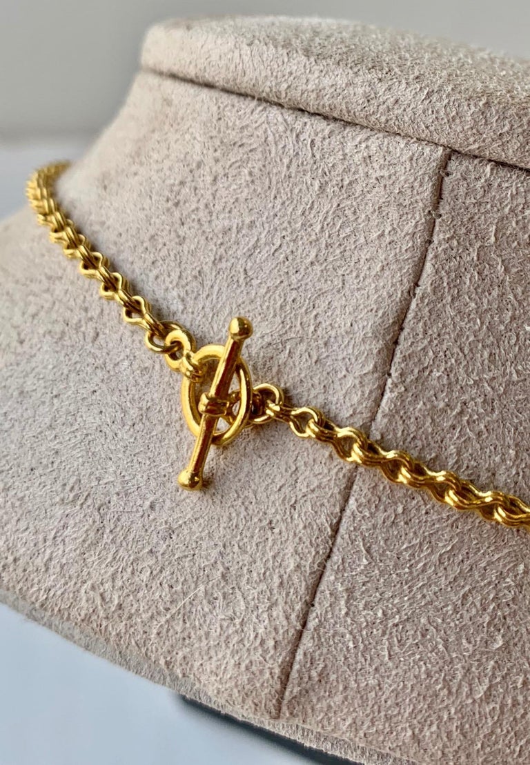 Yellow Gold 22 Karat Gold and Lava Packages Pendant Necklace at 1stDibs