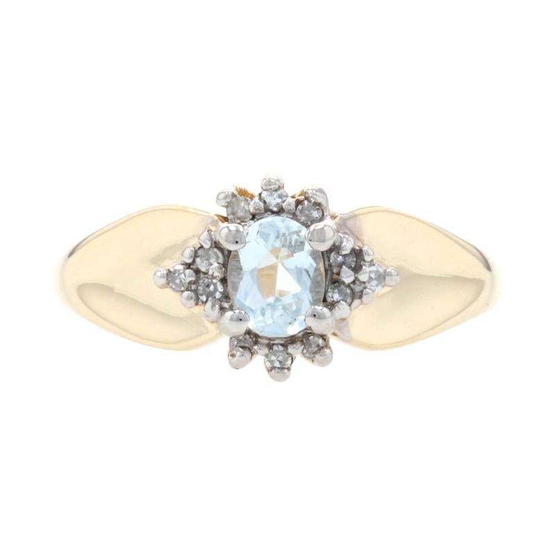 Elongated Oval Aquamarine Ring with Diamond Surround at 1stDibs