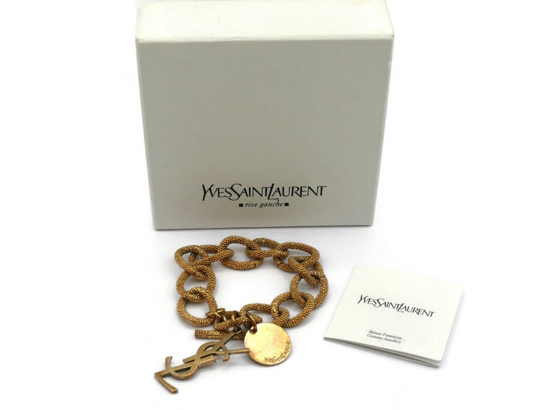 YVES SAINT LAURENT YSL Gold Tone Chain Logo Charm Bracelet For Sale at ...