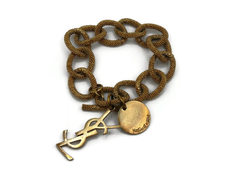 YVES SAINT LAURENT YSL Gold Tone Chain Logo Charm Bracelet For Sale at ...