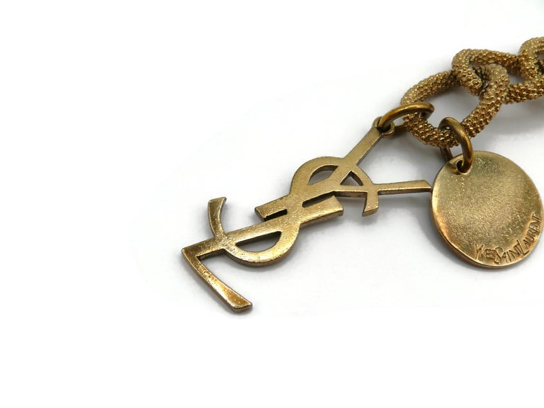 YVES SAINT LAURENT YSL Gold Tone Chain Logo Charm Bracelet For Sale at ...